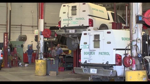 Border Patrol vehicles inside maintenanc... | Stock Video | Pond5