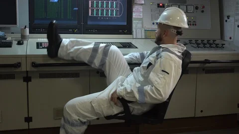 bored engineer sitting in a chair with h... | Stock Video | Pond5