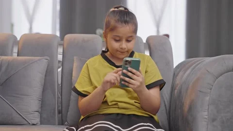 Kid Scrolling Phone Stock Video Footage | Royalty Free Kid Scrolling ...