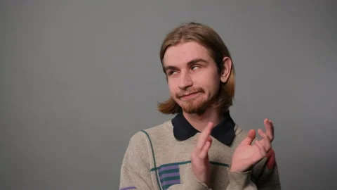 Bored young man clapping hands | Stock Video | Pond5