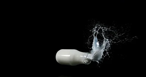 Bottle of Milk Falling and Splatching ag... | Stock Video | Pond5