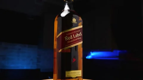 A bottle of Red Label Scotch whisky on a... | Stock Video | Pond5