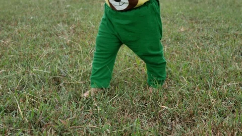 Bottom view Baby asian boy walking in th... | Stock Video | Pond5