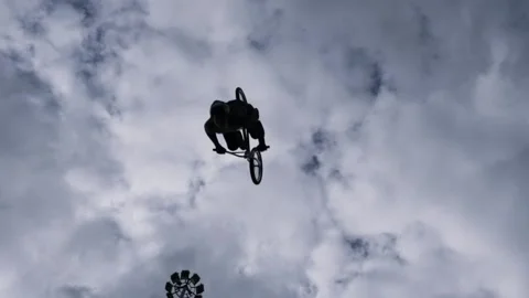 Bottom view of a boy silhouette jumping ... | Stock Video | Pond5