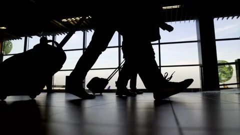 Bottom view of passenger legs walking at... | Stock Video | Pond5