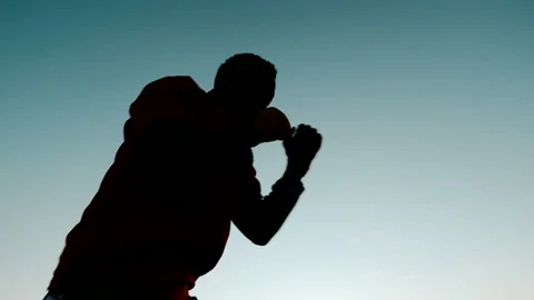 Bottom view of a silhouette black man in... | Stock Video | Pond5