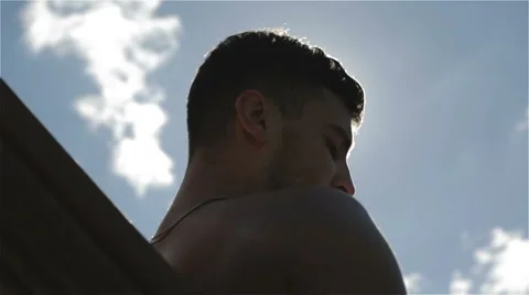 Bottom view. The young man is training a... | Stock Video | Pond5