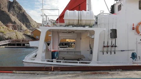 Bouncing fishing boat on waves in harbor... | Stock Video | Pond5