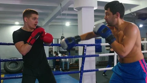 Box training - two men having a fight on... | Stock Video | Pond5