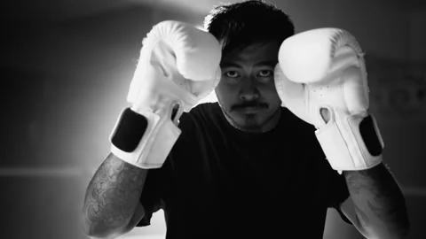 Boxer in Dramatic Standoff Pose Facing R... | Stock Video | Pond5