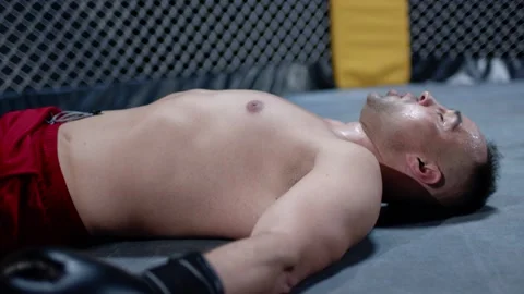 Boxer falling down to boxing ring floor ... | Stock Video | Pond5