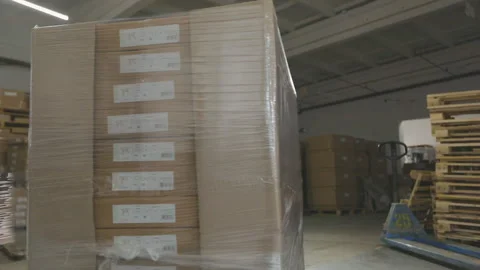 Boxes with finished products are wrapped... | Stock Video | Pond5