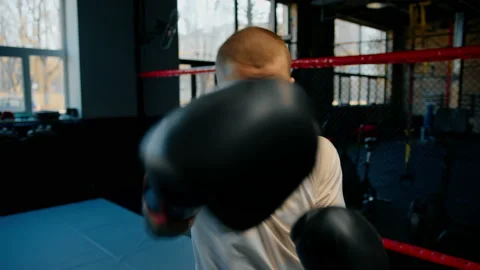 Boxing gym a boxer trains his punches hi... | Stock Video | Pond5