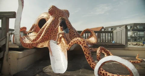 Boy And Girl Playing On Large Octopus Sl... | Stock Video | Pond5
