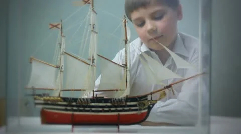 boy and a ship model 002 | Stock Video | Pond5