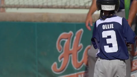 A boy at bat playing in a little league ... | Stock Video | Pond5