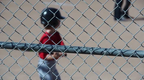 A boy is at bat while playing little lea... | Stock Video | Pond5