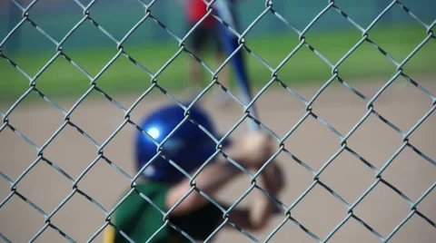 A boy is at bat while playing little lea... | Stock Video | Pond5