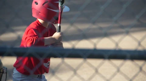 A boy is at bat while playing little lea... | Stock Video | Pond5