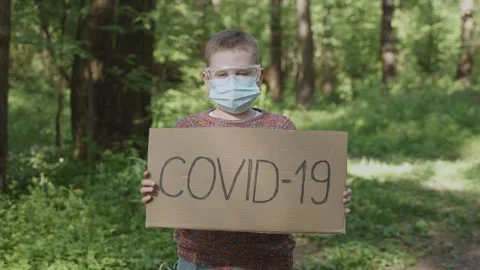 Boy with blink tics demonstrates poster ... | Stock Video | Pond5