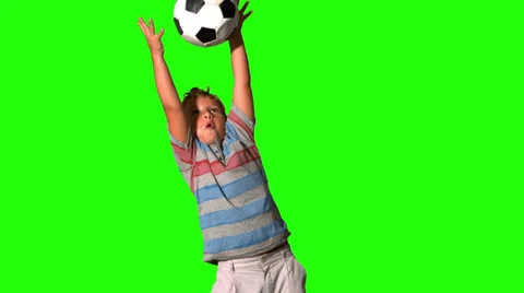 Boy catching football on green screen | Stock Video | Pond5