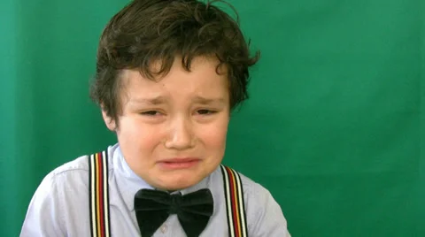 Boy crying in front of a green screen 2 | Stock Video | Pond5