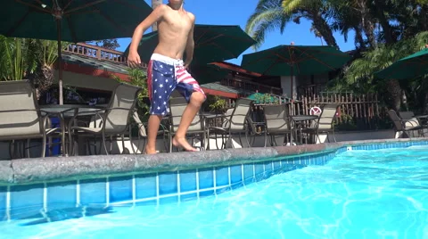 A boy doing a cannonball and jumping int... | Stock Video | Pond5