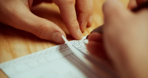 Boy drawing a decorative border. Practic... | Stock Video | Pond5