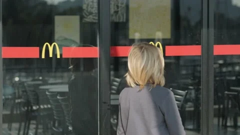 boy enters in McDonalds Restaurant, McDo... | Stock Video | Pond5