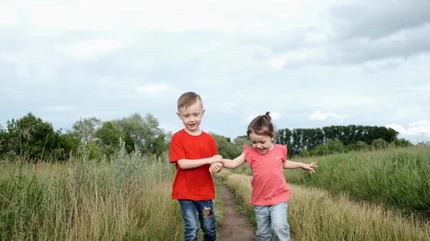 Boy, girl playing catch-up. brother sist... | Stock Video | Pond5