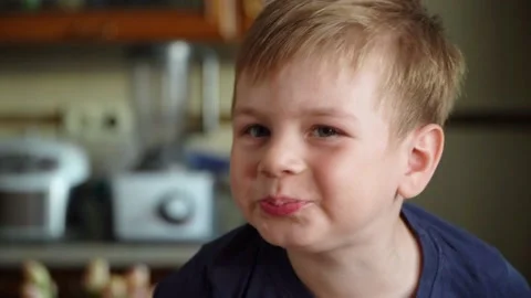 The boy indulges and spits saliva | Stock Video | Pond5