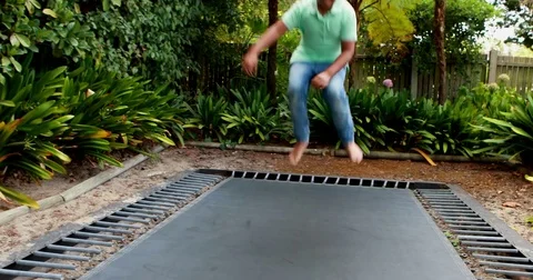 Boy jumping up and down on bouncing tram... | Stock Video | Pond5