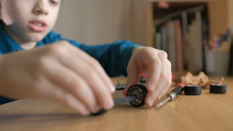 the boy looks how work wheels the swivel... | Stock Video | Pond5