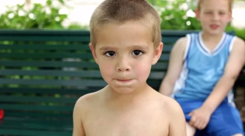 Boy making silly face with brother in ba... | Stock Video | Pond5