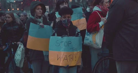 Boy with picket sign reading "Stop The W... | Stock Video | Pond5
