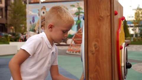 A boy is playing interactive games on th... | Stock Video | Pond5