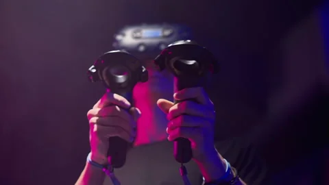 Boy playing VR games in a studio with bl... | Stock Video | Pond5