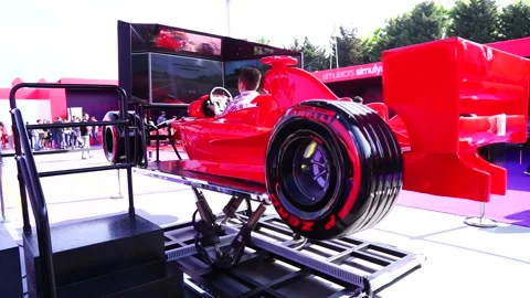 boy riding on the simulator car racing r... | Stock Video | Pond5