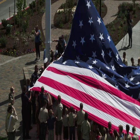 Boy Scouts holding American Flag as it i... | Stock Video | Pond5