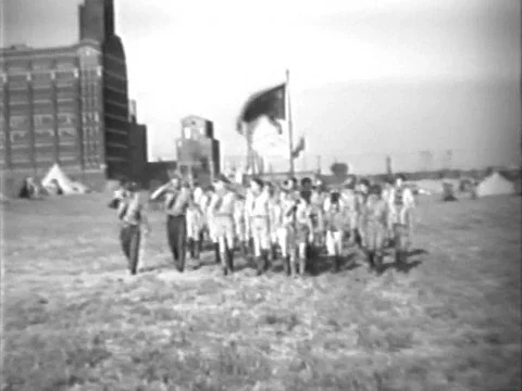 Boy scouts start a fire, set up tents, c... | Stock Video | Pond5