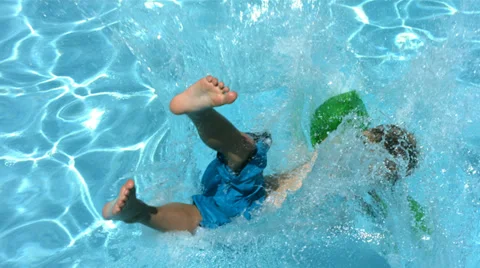 Boy splashing into pool, slow motion | Stock Video | Pond5