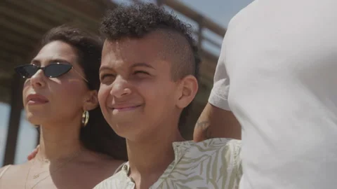 A Boy Standing Between His Parents at th... | Stock Video | Pond5