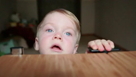 The boy stands at the table and cries | Stock Video | Pond5