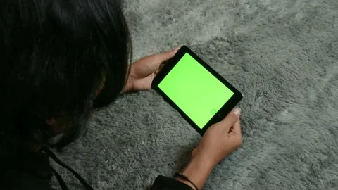 Boy Swipe and Watching A Tablet With A G... | Stock Video | Pond5