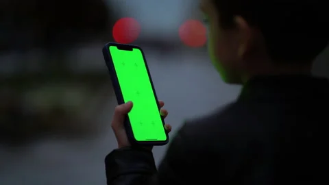 Boy tapping on the green screen of his s... | Stock Video | Pond5