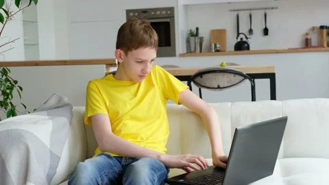 Boy teenager doing homework at home. Bac... | Stock Video | Pond5