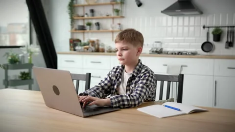 Boy Typing on Laptop At Home. Kid studyi... | Stock Video | Pond5