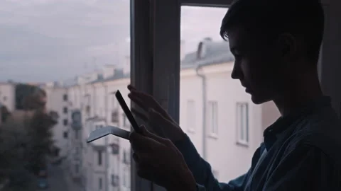 boy uses the tablet on the background of... | Stock Video | Pond5