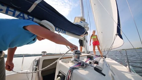 Boy wind-up rope on pintle under mast wi... | Stock Video | Pond5