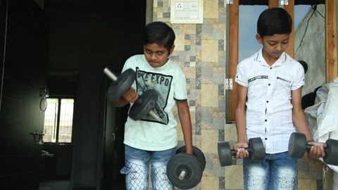 The boys do heavy dumbbell exercises for... | Stock Video | Pond5